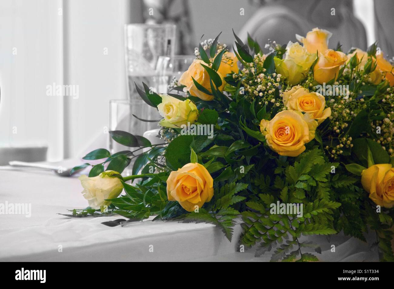 A bouquet of yellow roses displayed at a wedding Stock Photo - Alamy