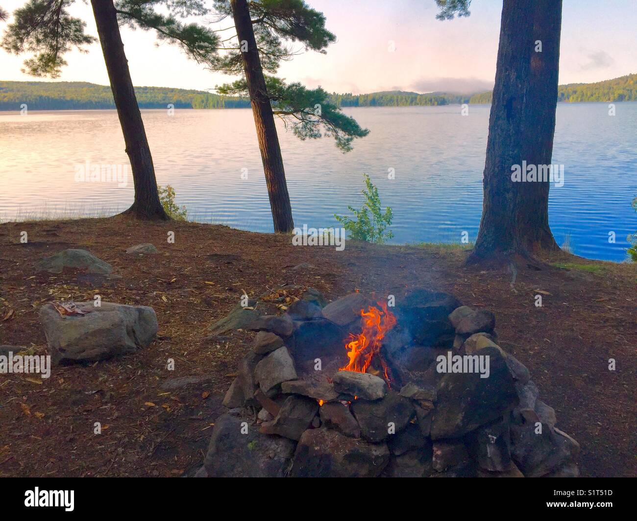 Campfire Flames At Lake Stock Photo - Alamy