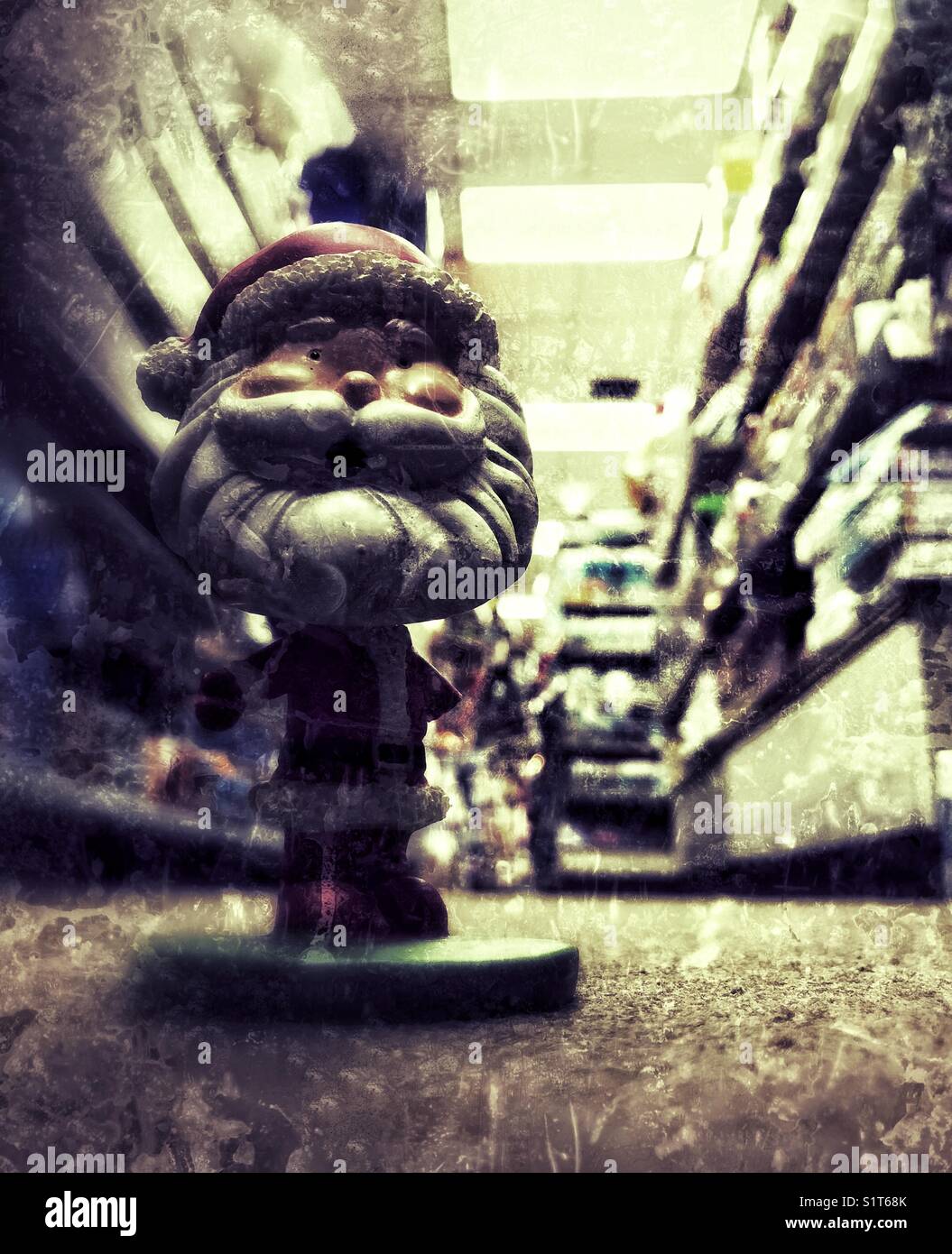 Santa bobble head toy on the floor of a small shop. Grunge Stock Photo ...