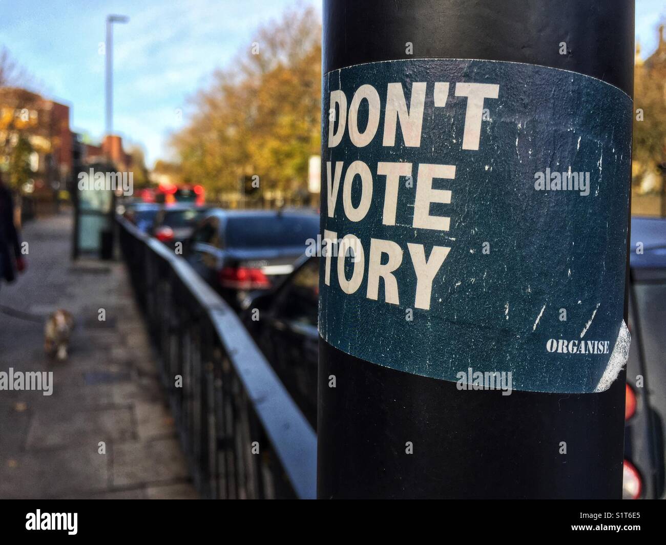 A 'Don't vote Tory' sticker on a lamppost in Archway in London, England ...