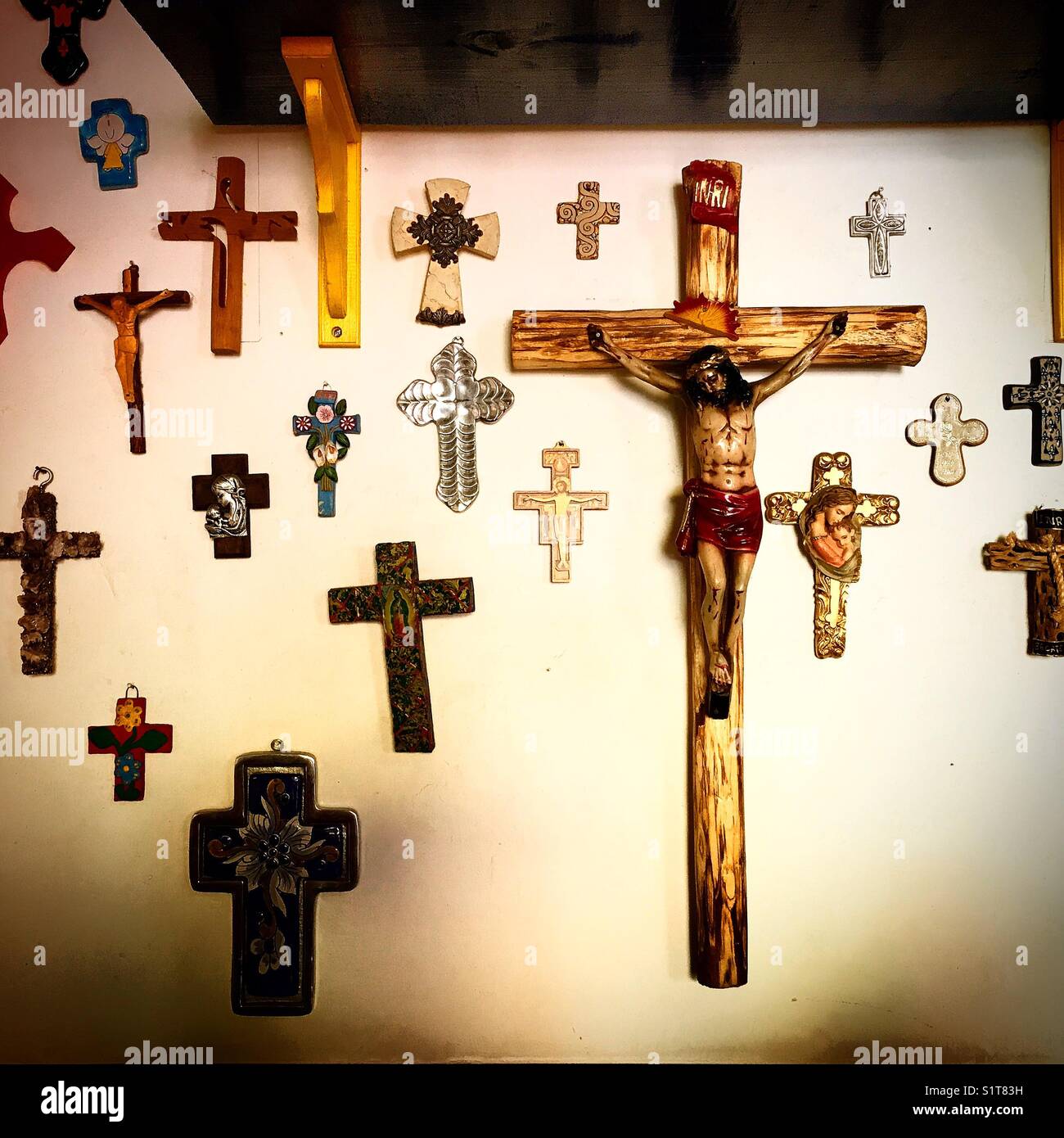 A crucifix surrounded by crosses decorates a restaurant in Guanajuato ...