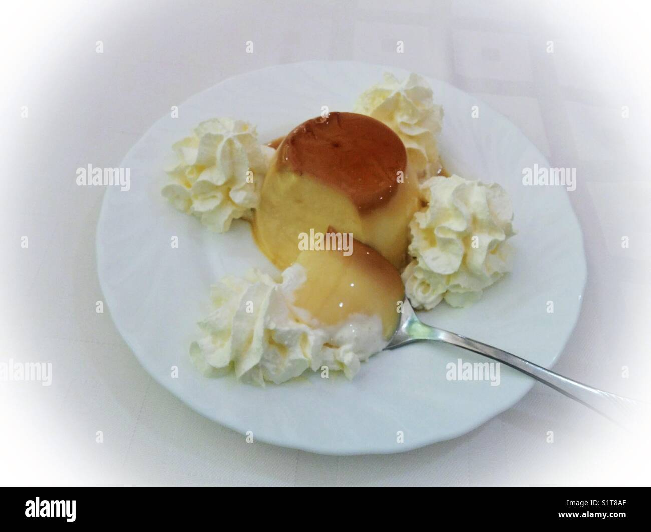 Creme caramel with cream Stock Photo - Alamy
