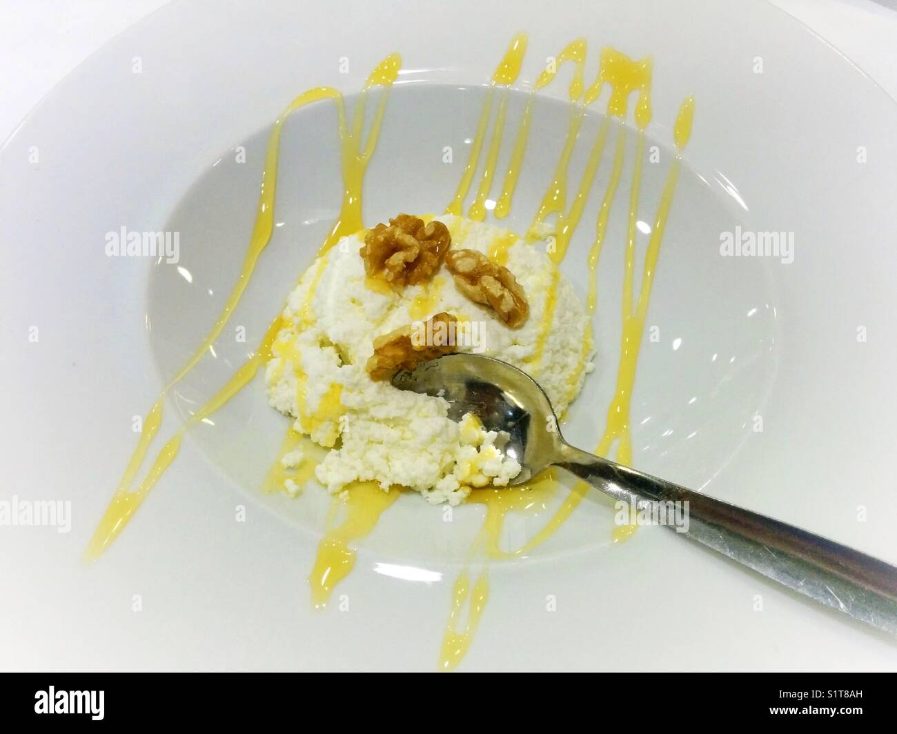 Honey spoons hi-res stock photography and images - Alamy