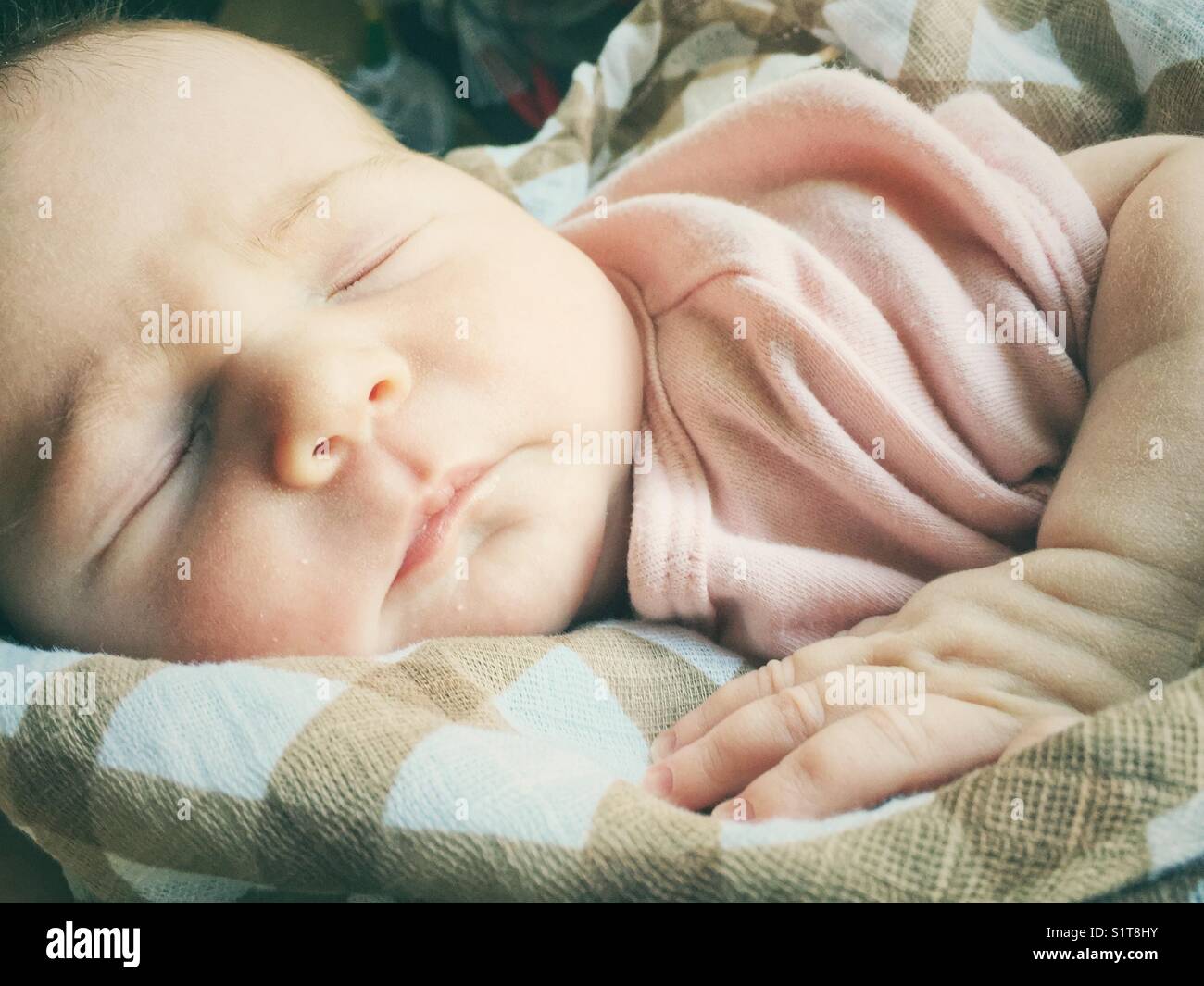Sleeping newborn baby girl with soft light and soft colours Stock Photo ...
