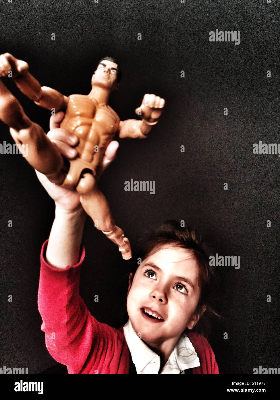 Girl holding action man toy hi-res stock photography and images - Alamy