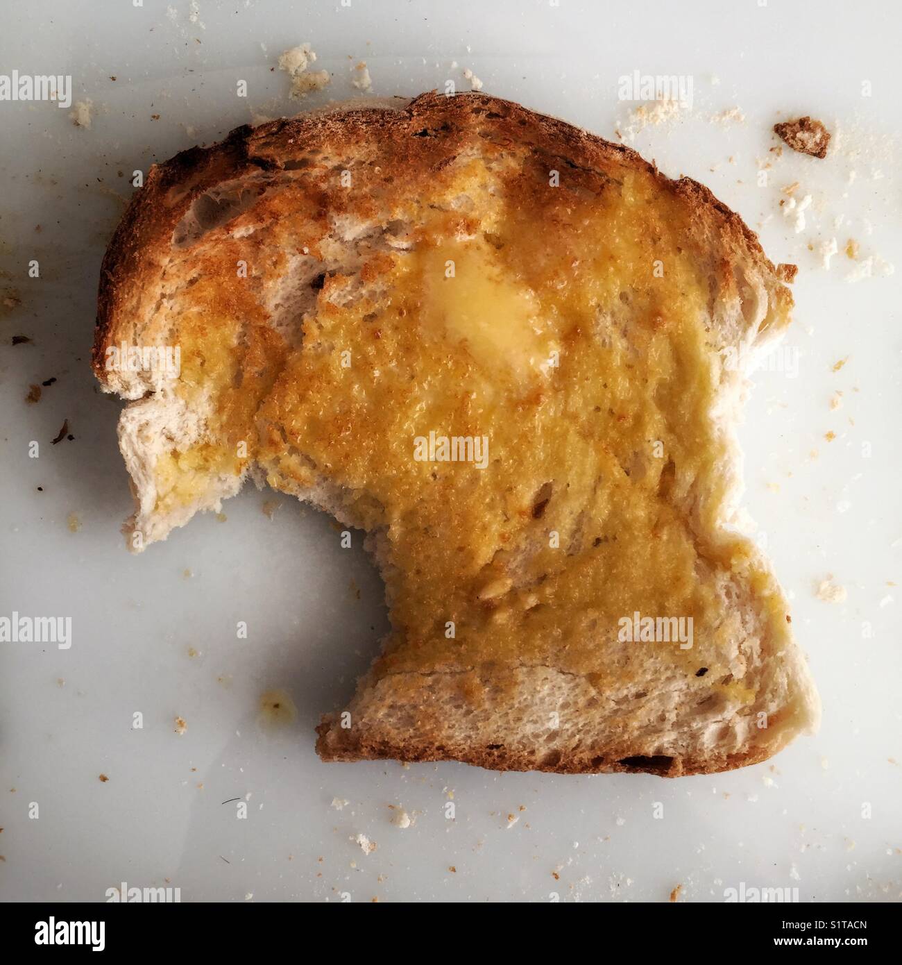 Toast with a bite Stock Photo - Alamy