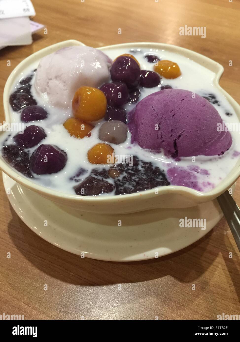 Purple potato ice cream in sweet red rice with taro balls Stock Photo ...