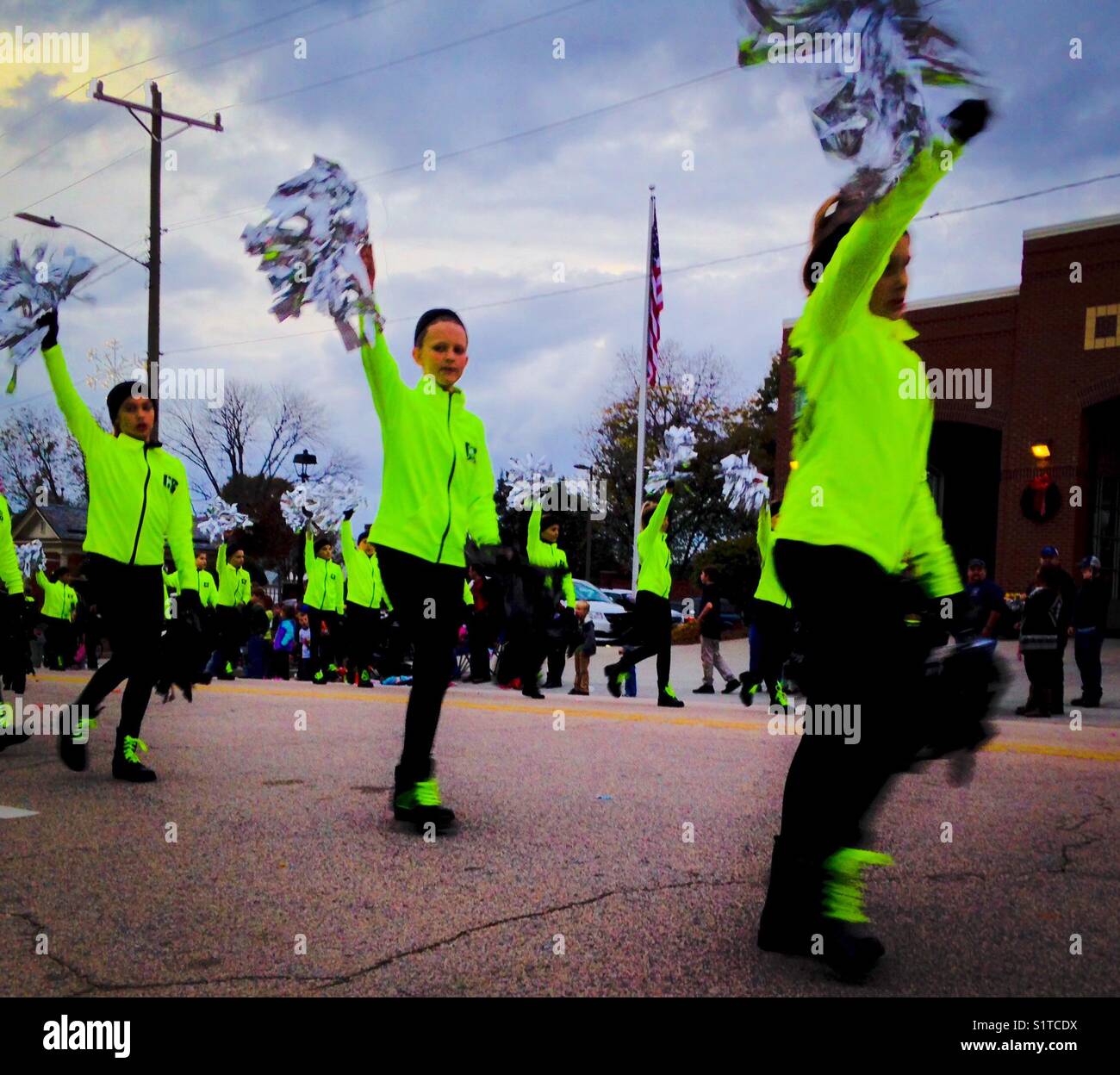 Yellow dancers in Christmas parade Stock Photo - Alamy