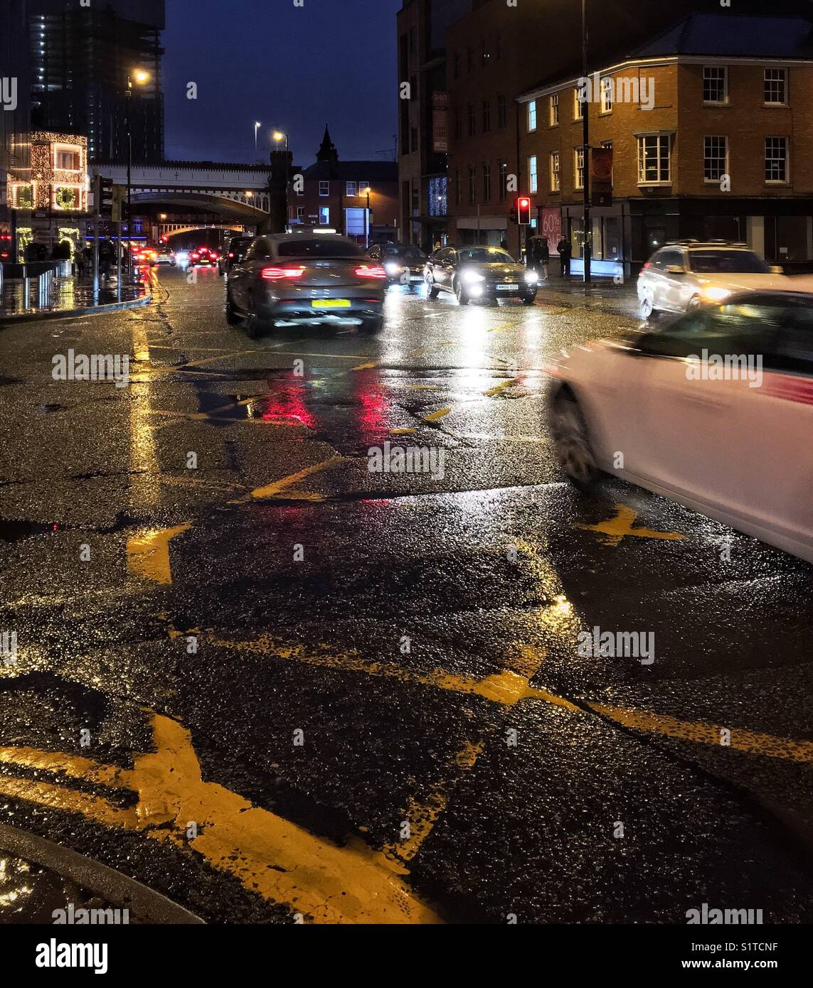 Rush Hour in the dark and rain on Deansgate, Manchester,UK Stock Photo ...