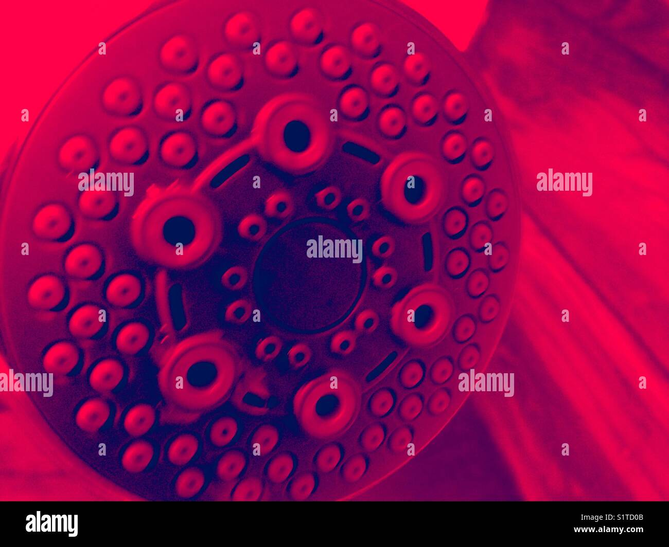 Red tinged photo of showerhead Stock Photo - Alamy