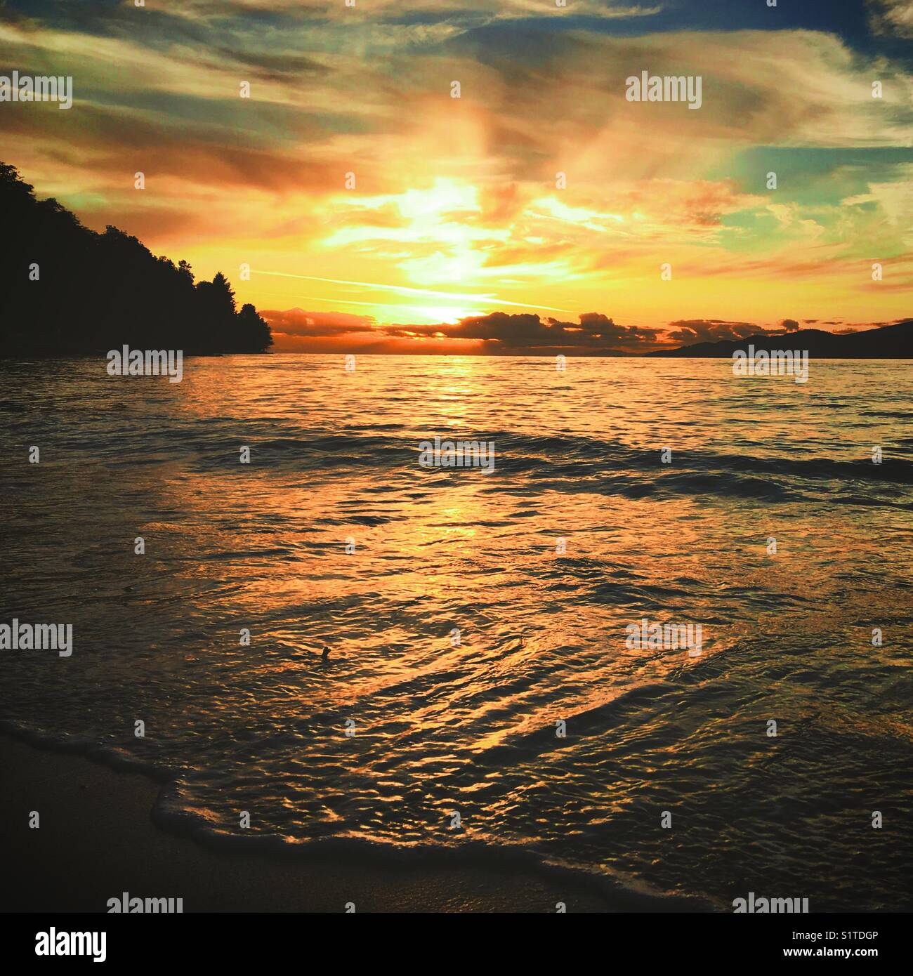 West coast sunset. Square crop Stock Photo - Alamy
