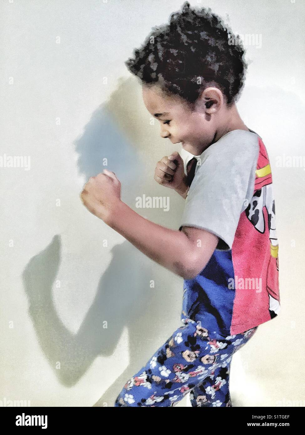 A little boy shadow boxing Stock Photo - Alamy