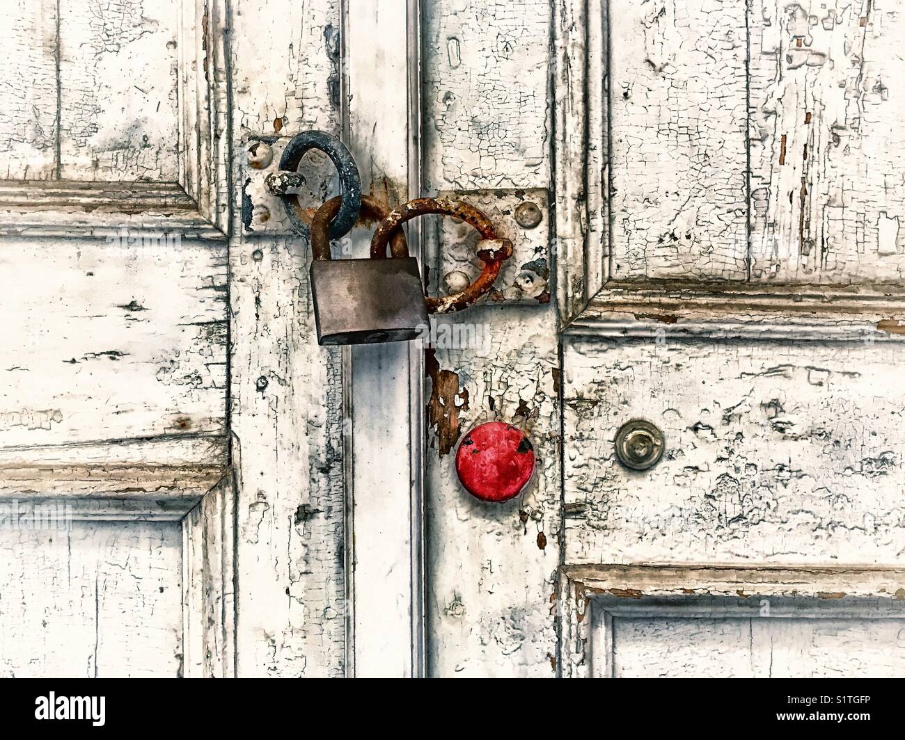 Old wooden door locked with rusty padlock Stock Photo - Alamy