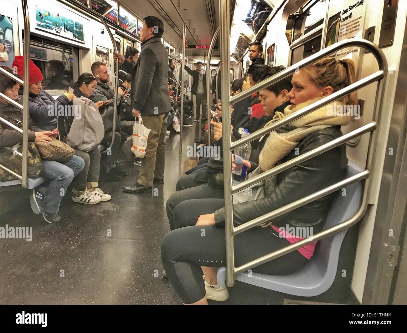Inside a NYC subway train car Stock Photo - Alamy