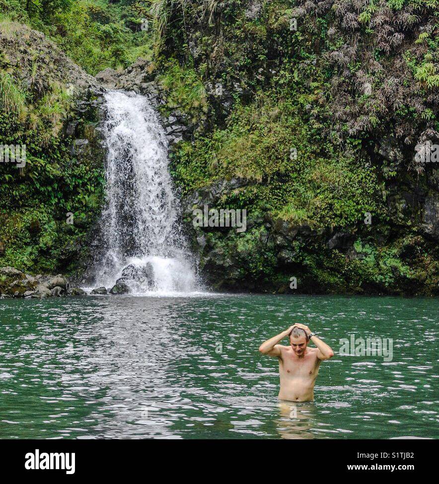 Swimming under the Hawaiian waterfalls Stock Photo - Alamy