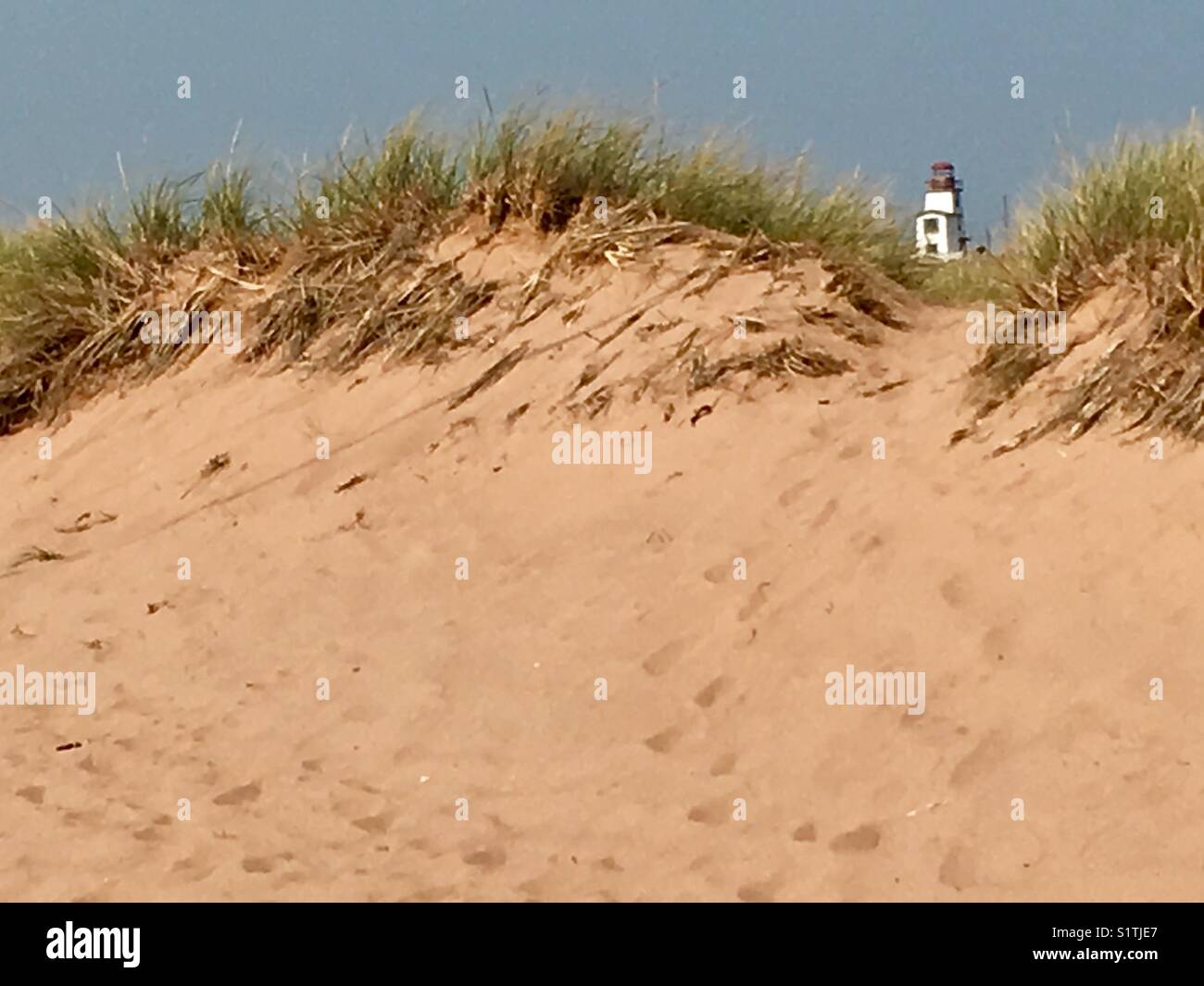 Sand dunes and lighthouse Stock Photo - Alamy