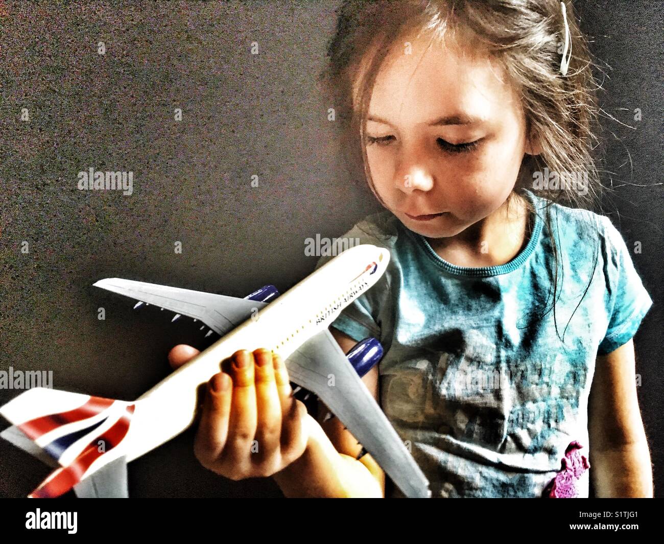 Girl holding model aircraft Stock Photo - Alamy