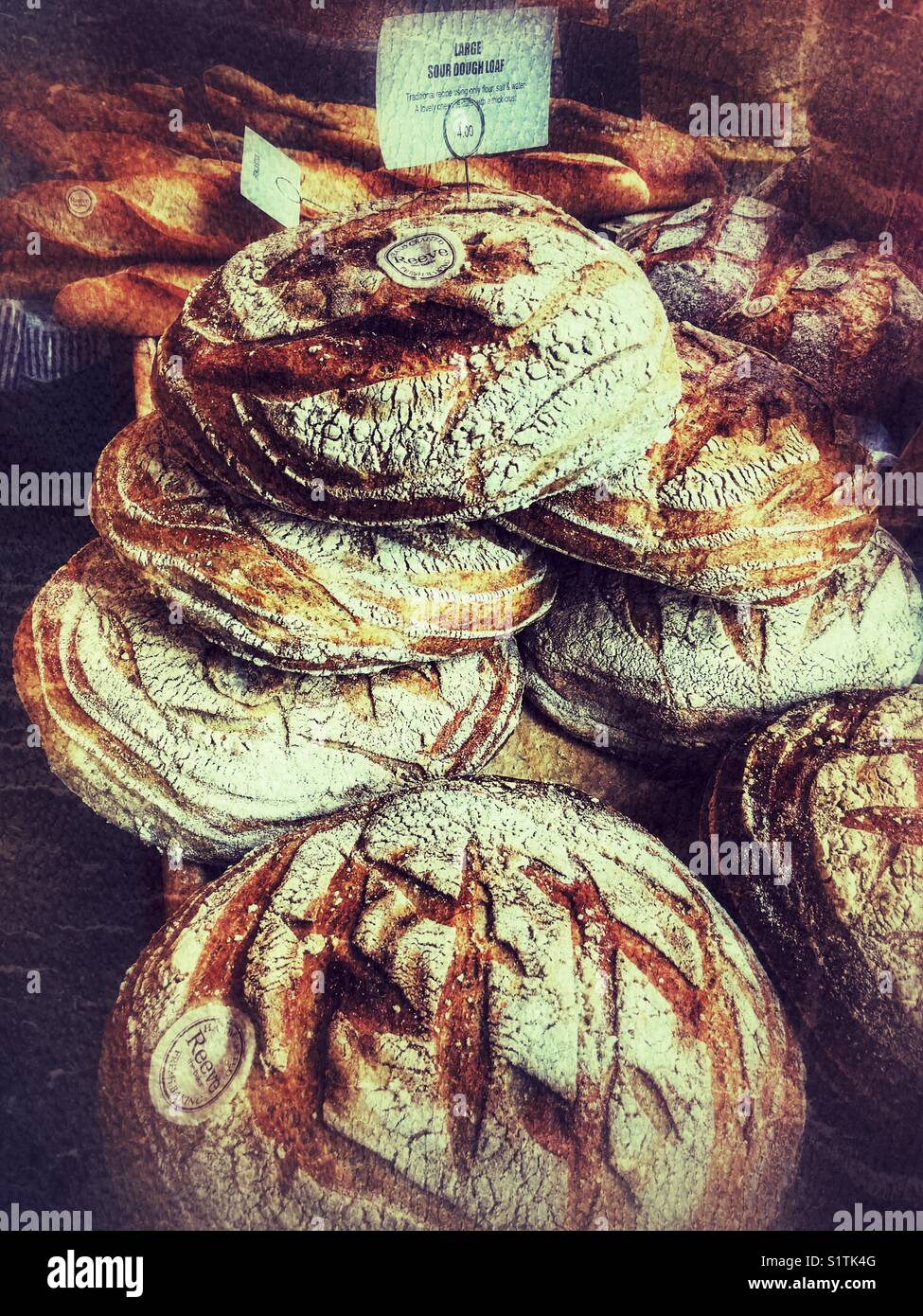 Bread display in a bakery window Stock Photo - Alamy