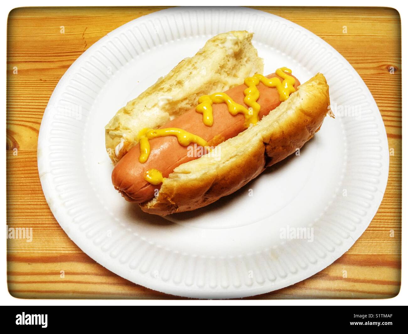 Hotdog with mustard Stock Photo - Alamy