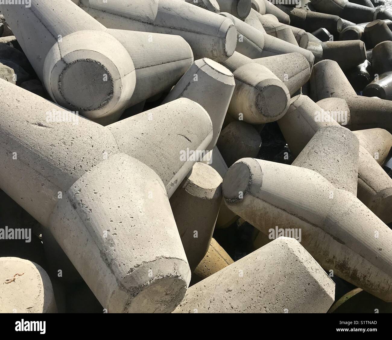Large heavy concrete shapes form parts of the sea defences for Funchal ...