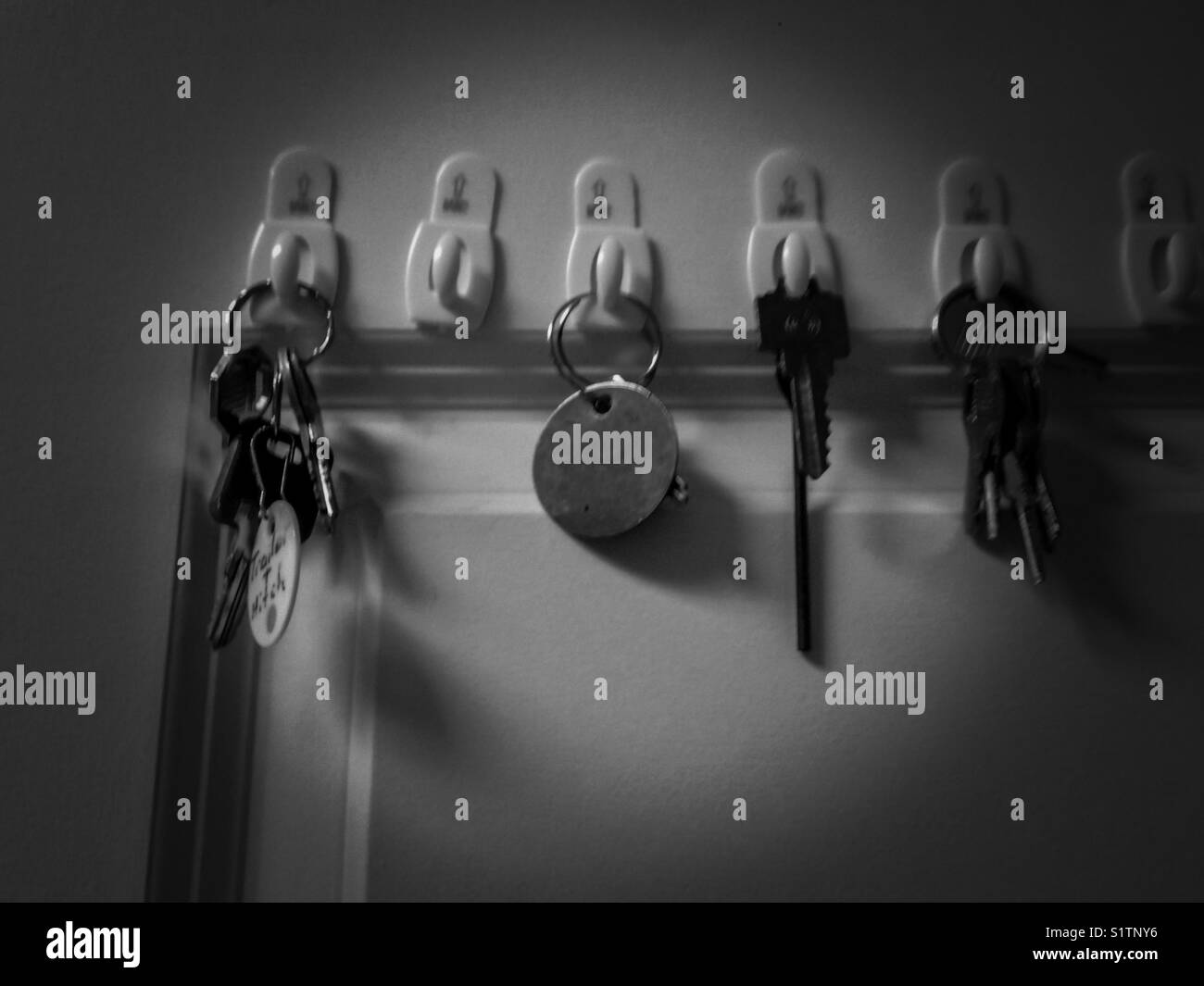 Keys hanging in a row Stock Photo - Alamy