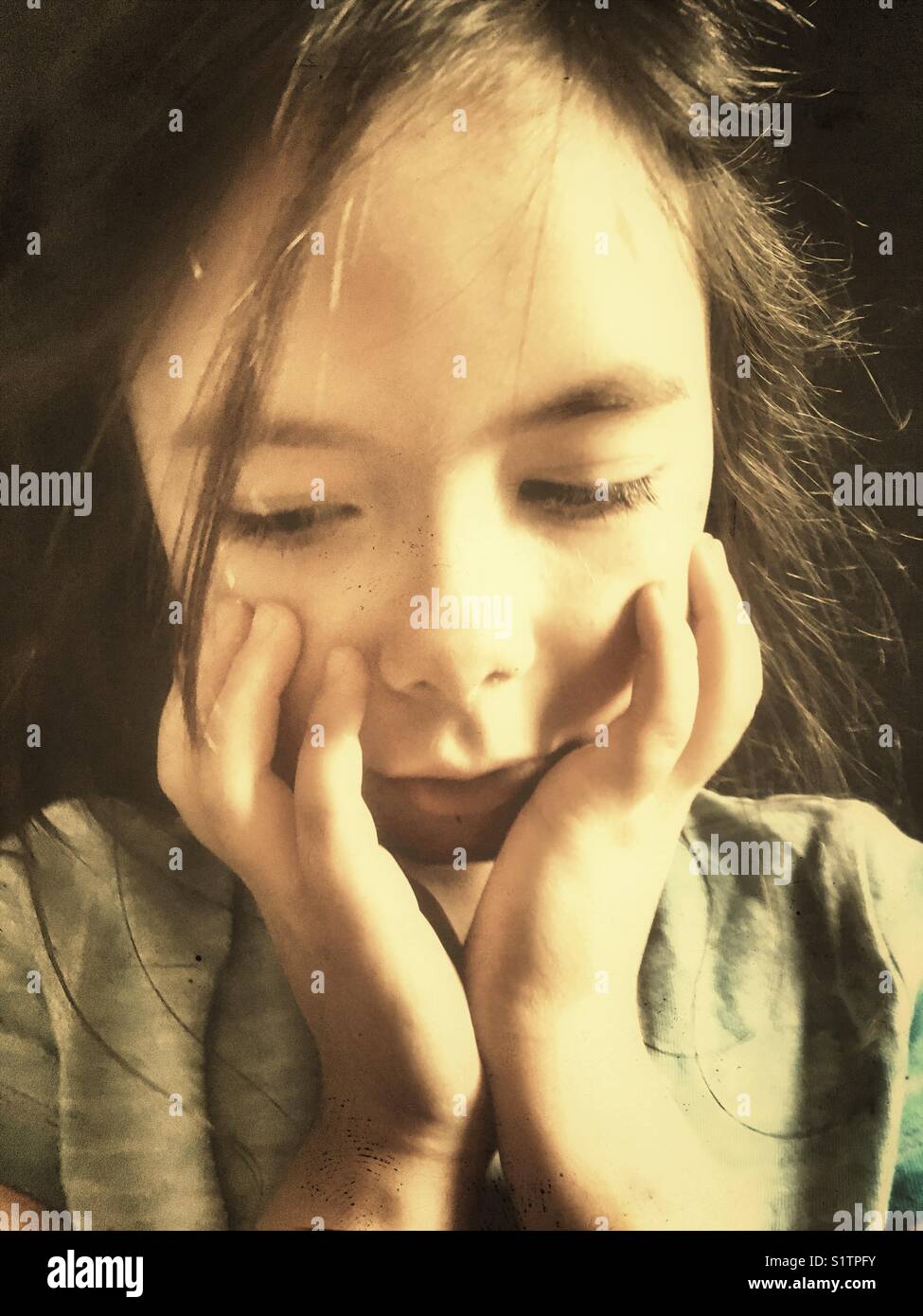 Young girl deep in thought Stock Photo - Alamy