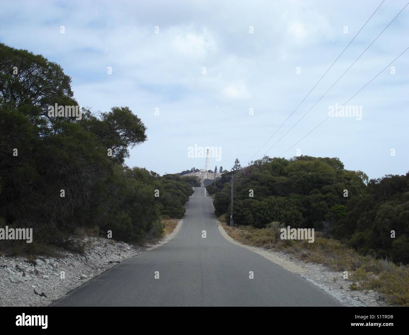 Long quiet road of Rottnest island Stock Photo - Alamy