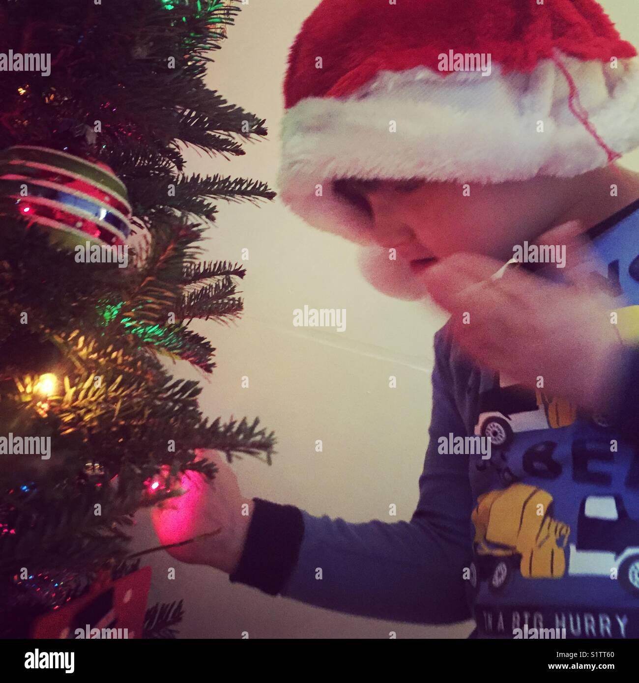 Santa fixing one little light that wasn’t quite right Stock Photo - Alamy