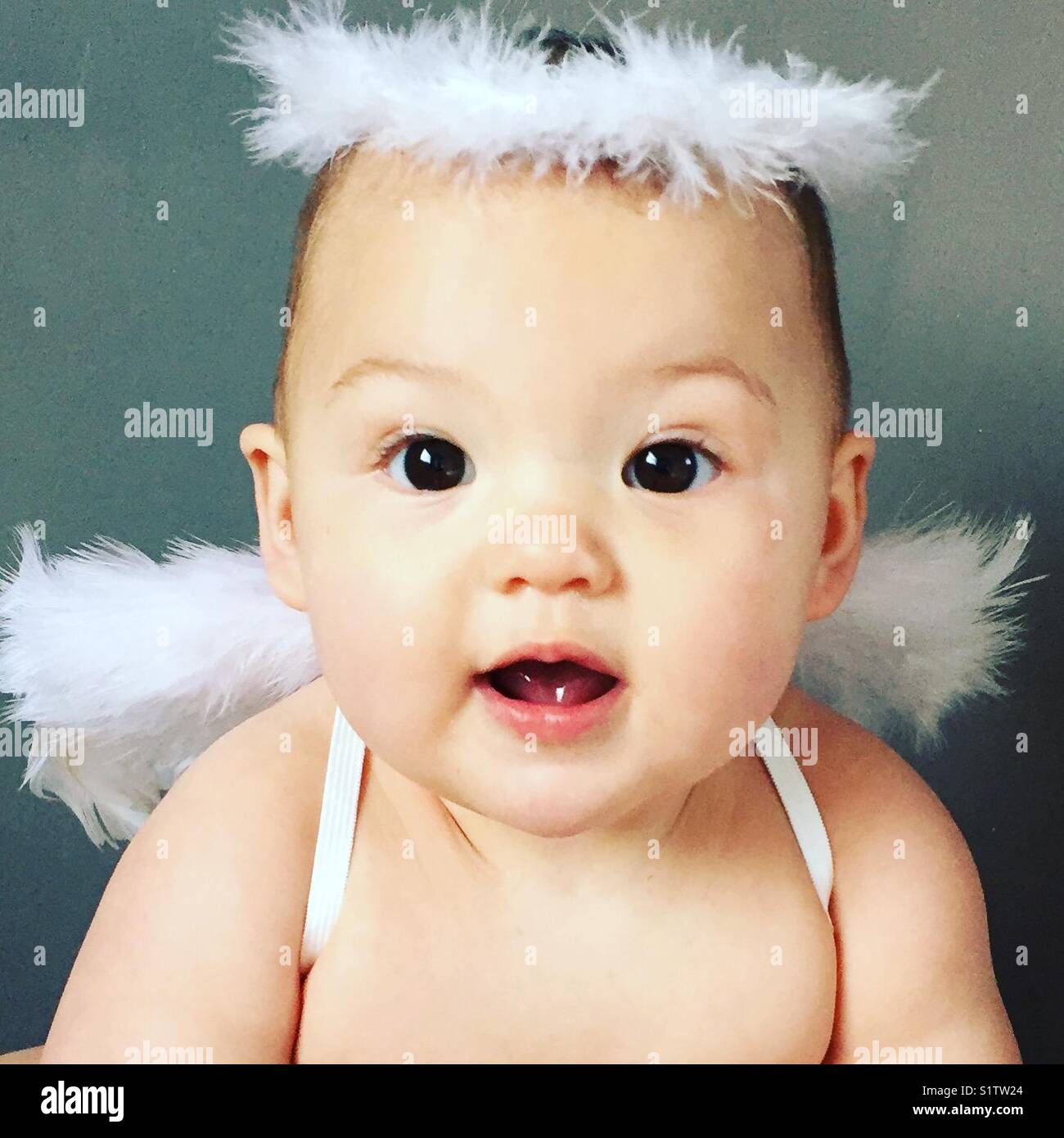 Baby angel face hi-res stock photography and images - Alamy