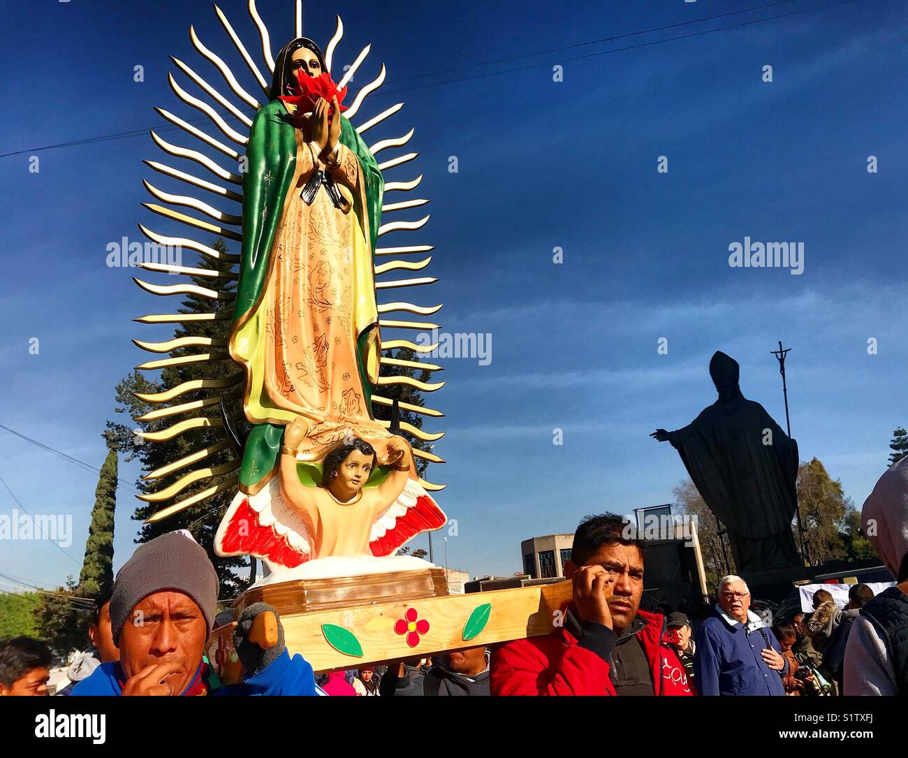 Pilgrims carry an image of Our Lady of Guadalupe during the annual ...
