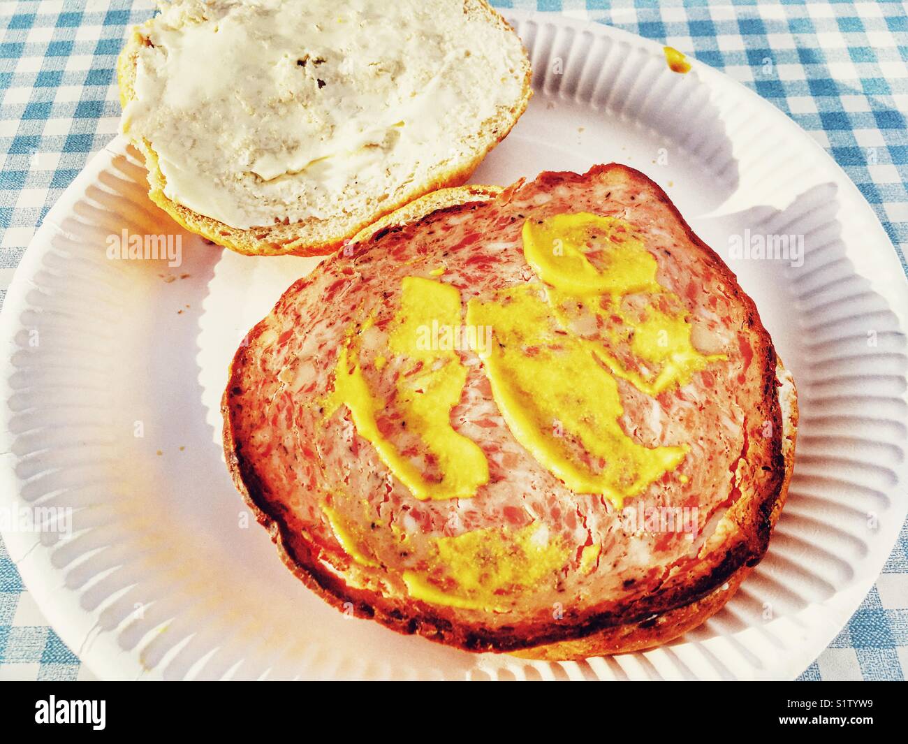 Haslet (pork rind) in bread roll with English mustard Stock Photo - Alamy