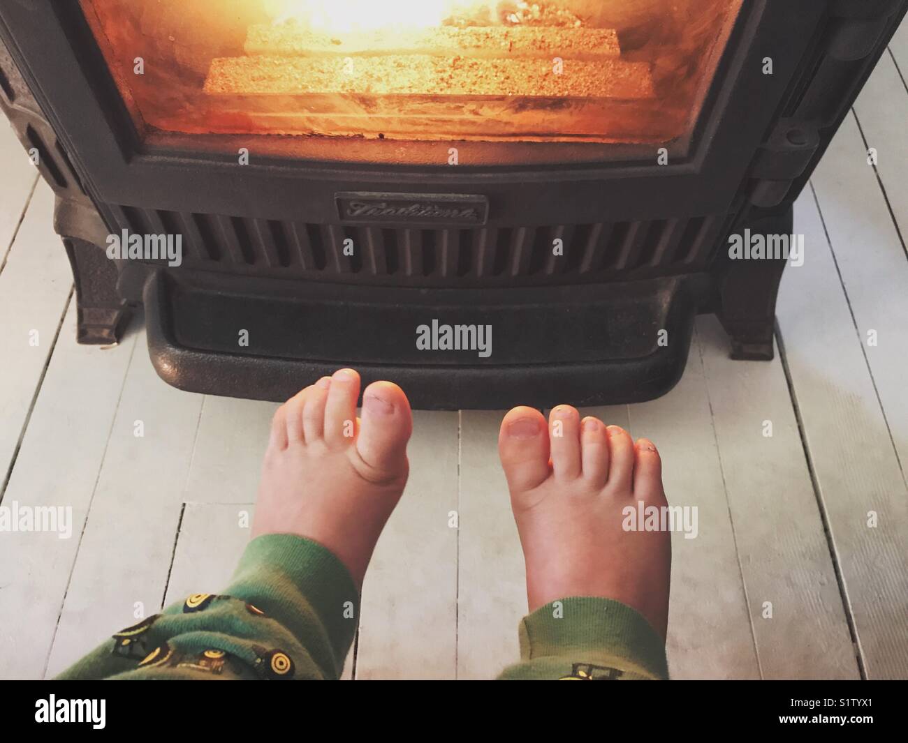 Feet to the fire hi-res stock photography and images - Alamy