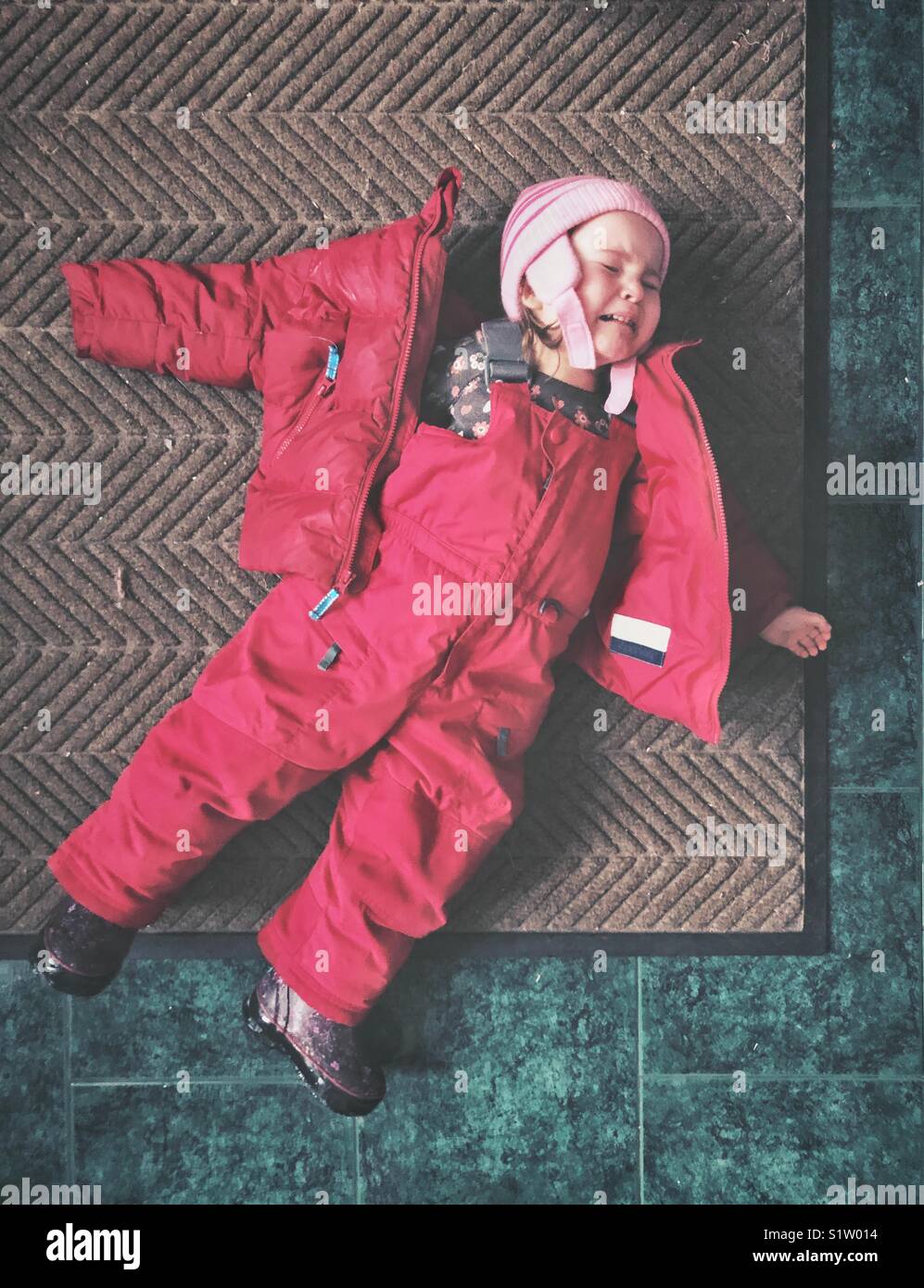 Toddler girl crying and having a temper tantrum while wearing pink ...