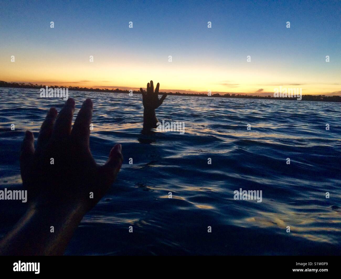 Hand coming out water hi-res stock photography and images - Alamy