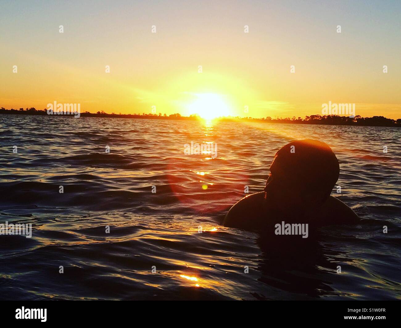 Boy looking out to ocean hi-res stock photography and images - Alamy