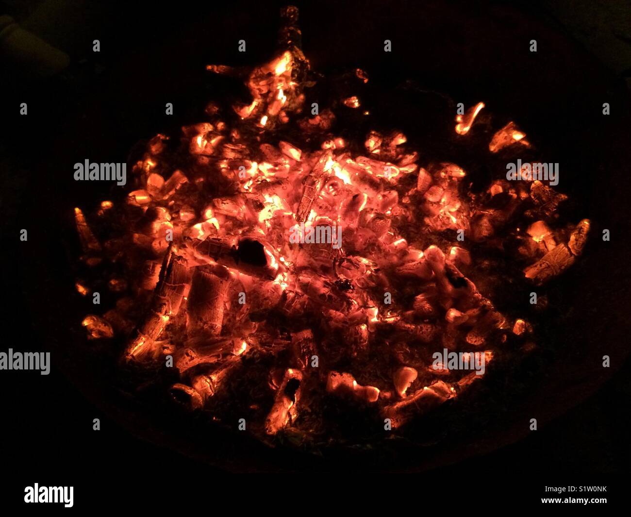 Fire under ash of coal Stock Photo - Alamy