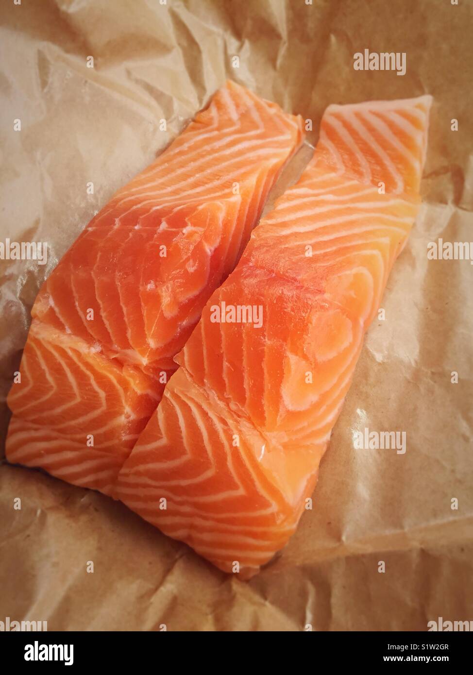 To salmon fillet‘s on butcher paper close-up detail Stock Photo - Alamy