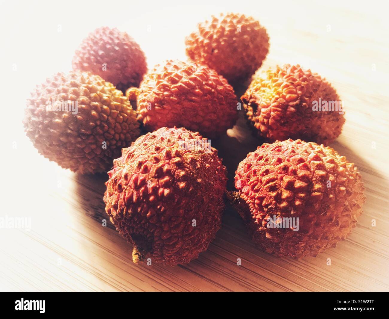 Fresh lychees on a bamboo board Stock Photo - Alamy