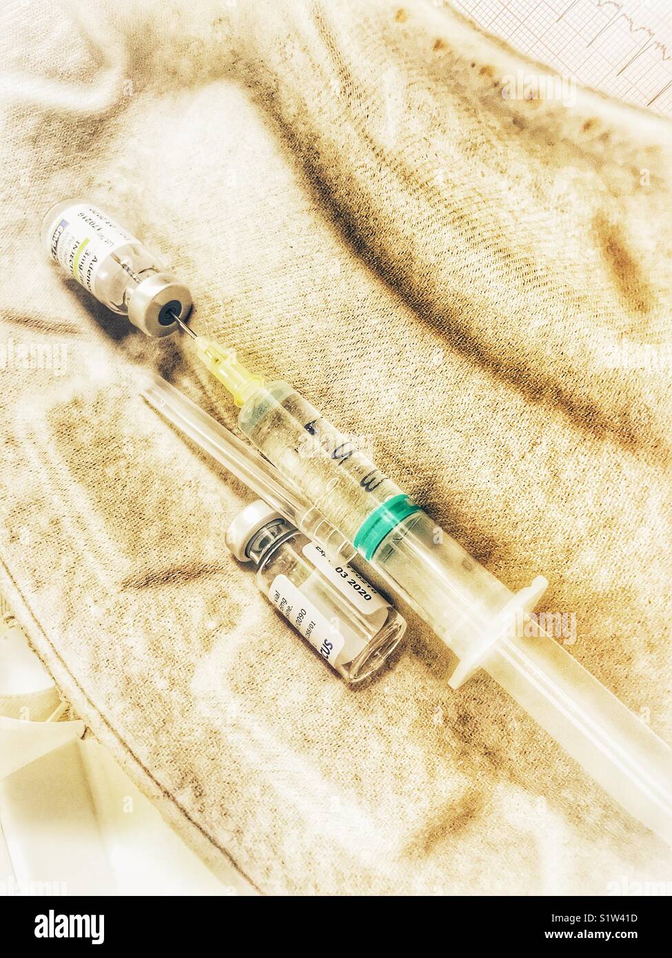 Hospital emergency. An injection of Adenosine used to treat tachycardia ...