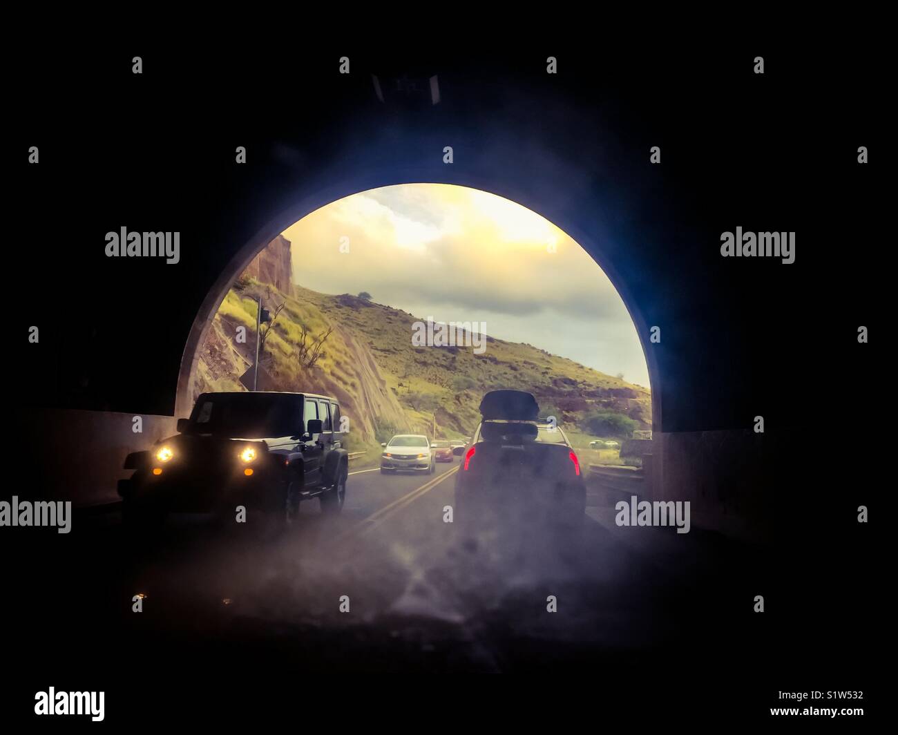 Through a tunnel in partial fog, Maui Stock Photo - Alamy