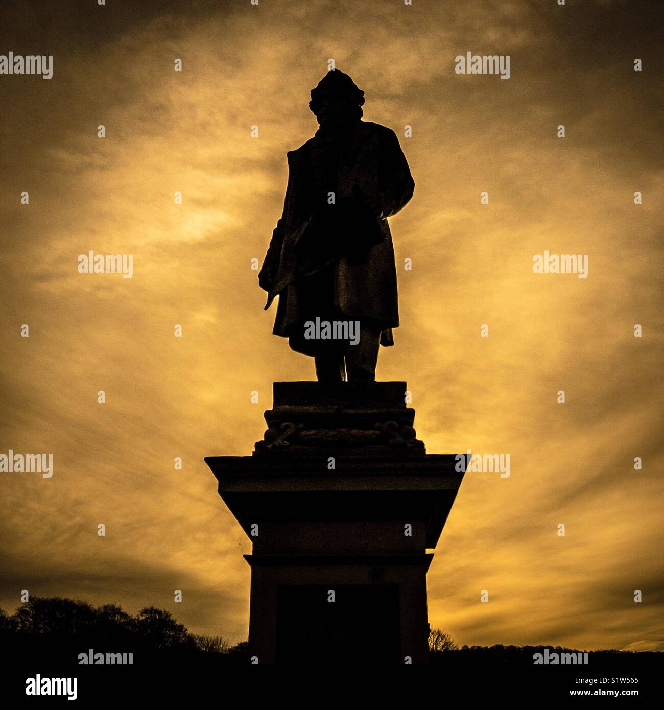 Silhouette of Sir Titus Salt statue in Roberts Park, Saltaire, West ...