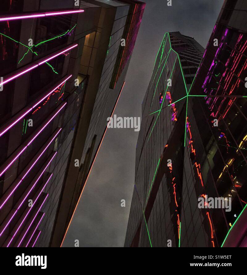 Neon lighting decorates highrise office buildings at dusk, Causeway Bay ...