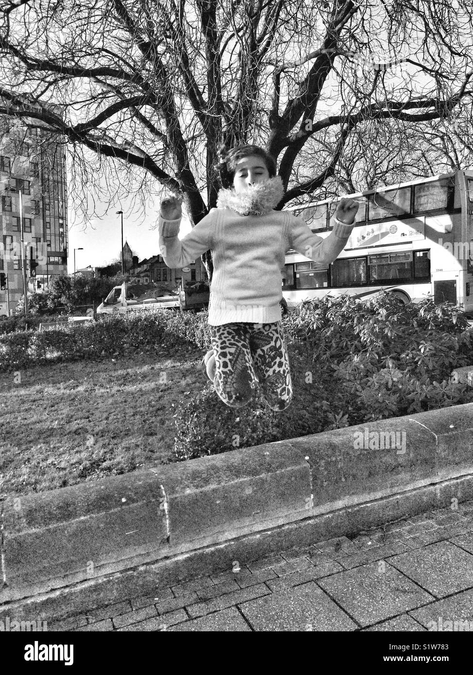 Child jumping hi-res stock photography and images - Alamy