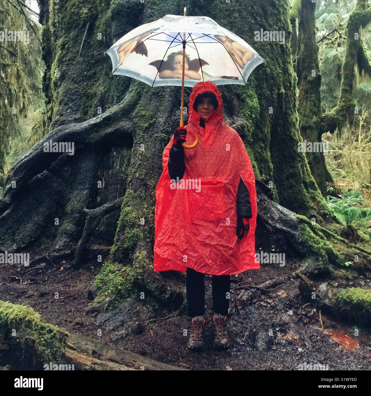 Woman in rain poncho hi-res stock photography and images - Alamy