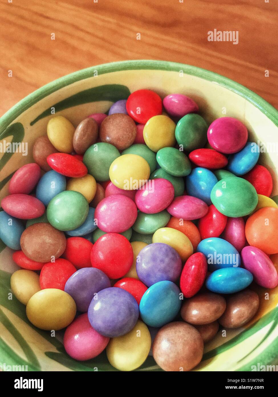Colourful smarties in a bowl Stock Photo - Alamy