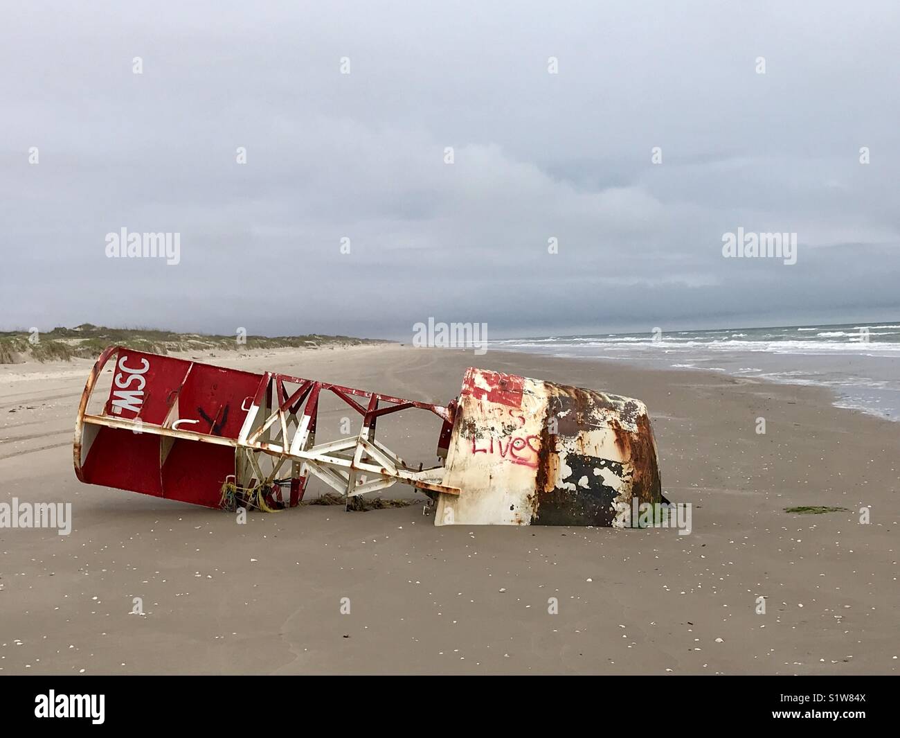 Ocean buoy on beach Stock Photo - Alamy