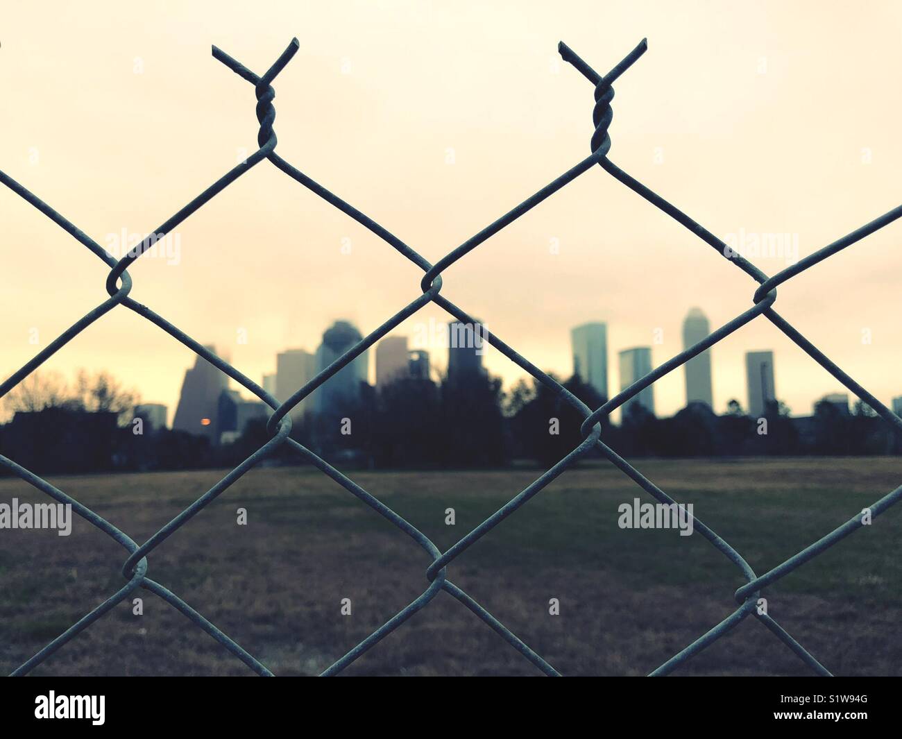 City background from a wire fence Stock Photo - Alamy