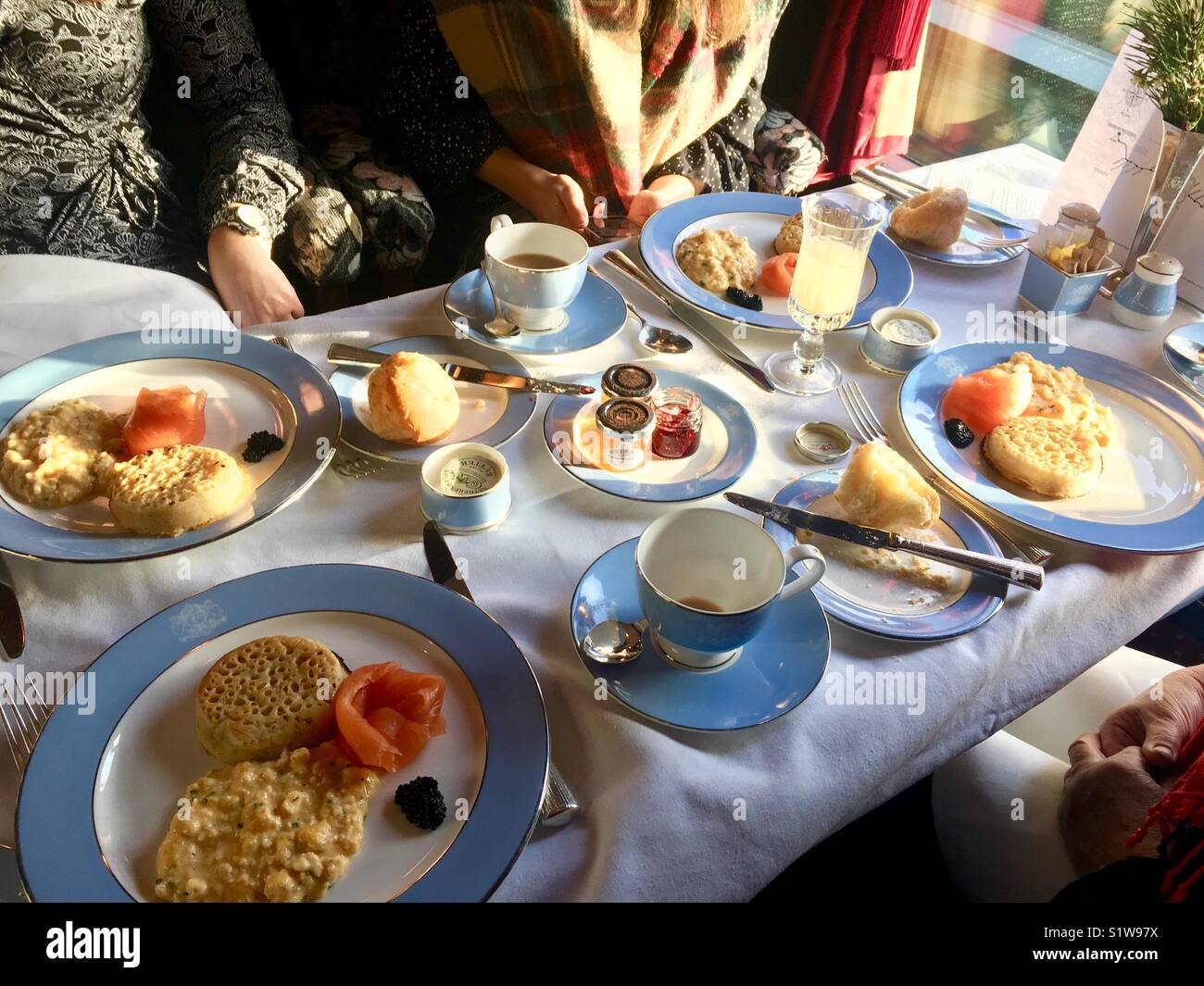 Party of four sitting down to breakfast on the train Stock Photo - Alamy
