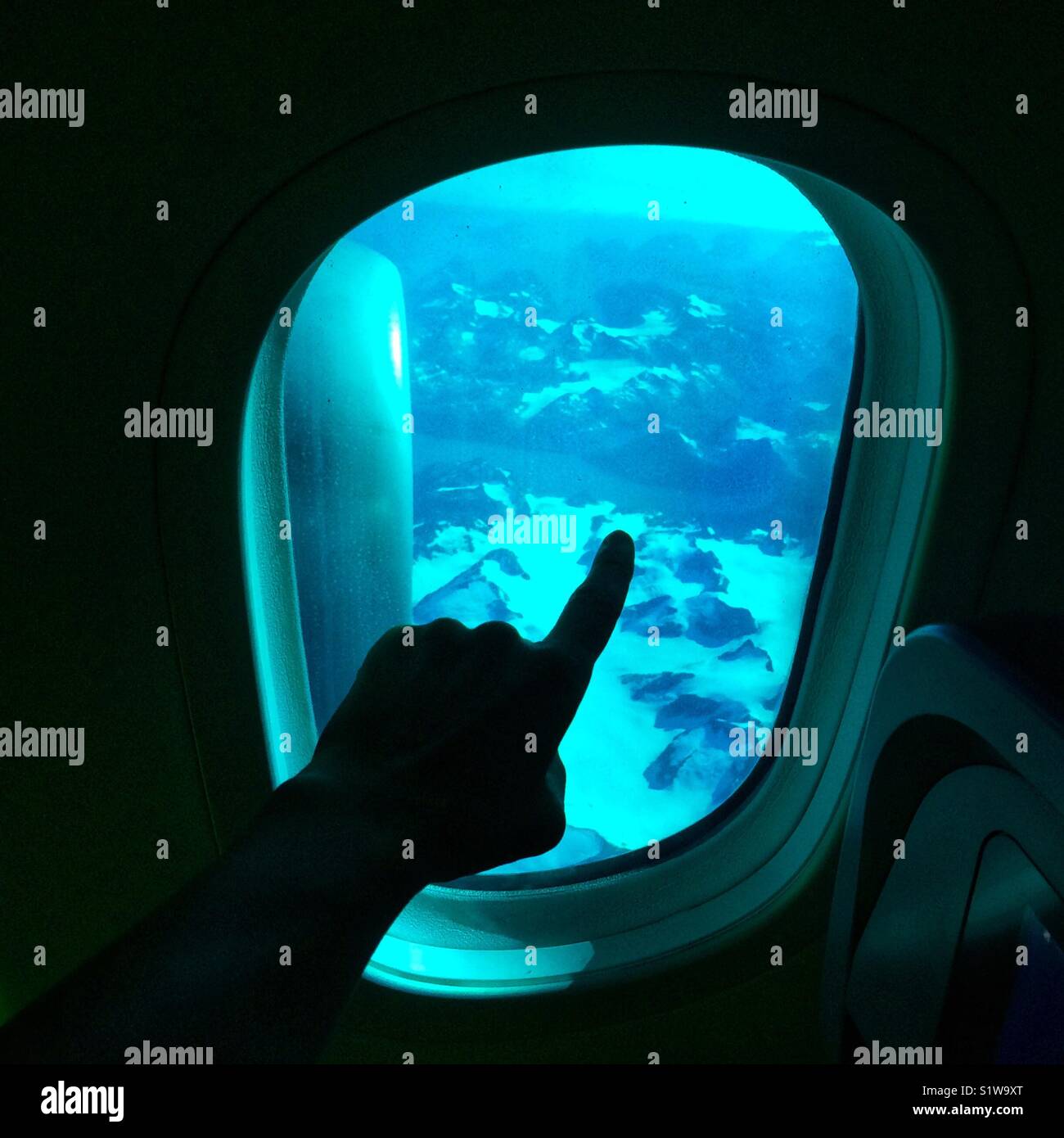 Looking out the window on an Boeing 757 airplane over Greenland ...