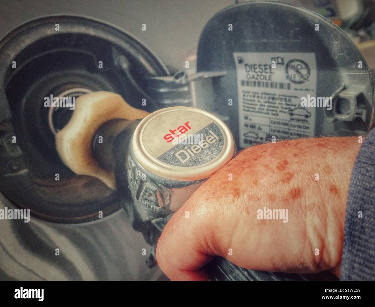 Gas station, filling diesel , nozzle, close up Stock Photo - Alamy